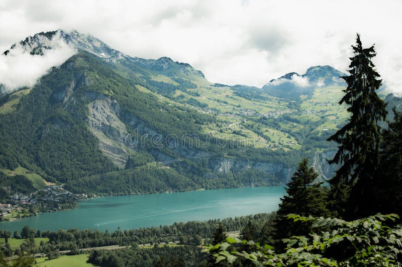 Lake in Swiss Alps stock photo. Image of blue, alps - 100509610