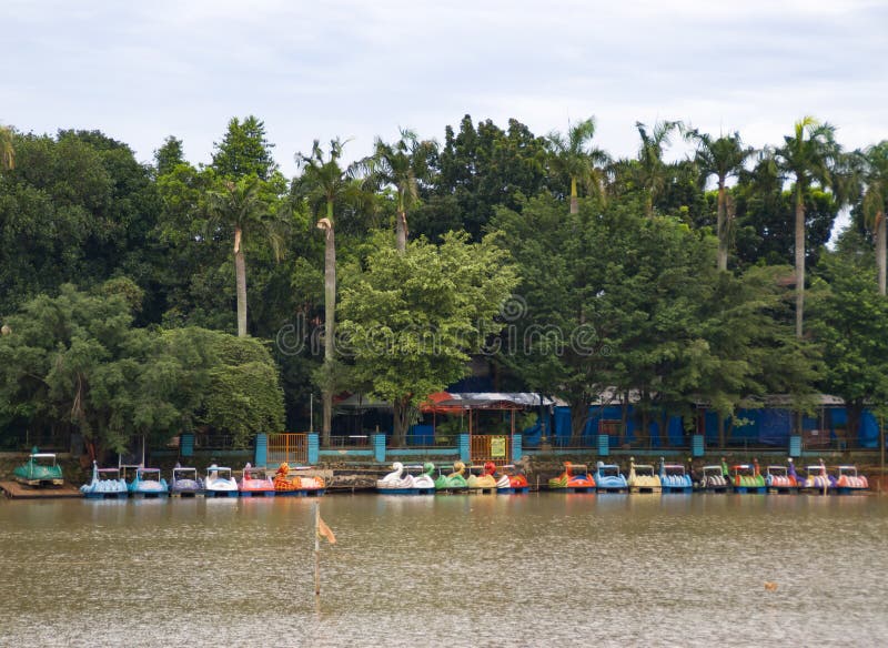 Lake, Trees and Colorfully Boats Lined Stock Image - Image of boats ...