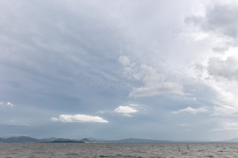 Lake with Very White Clouds Over an Island Stock Photo - Image of ...