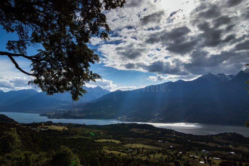 Lake View with Mountains from Behind the Trees Stock Image - Image of ...