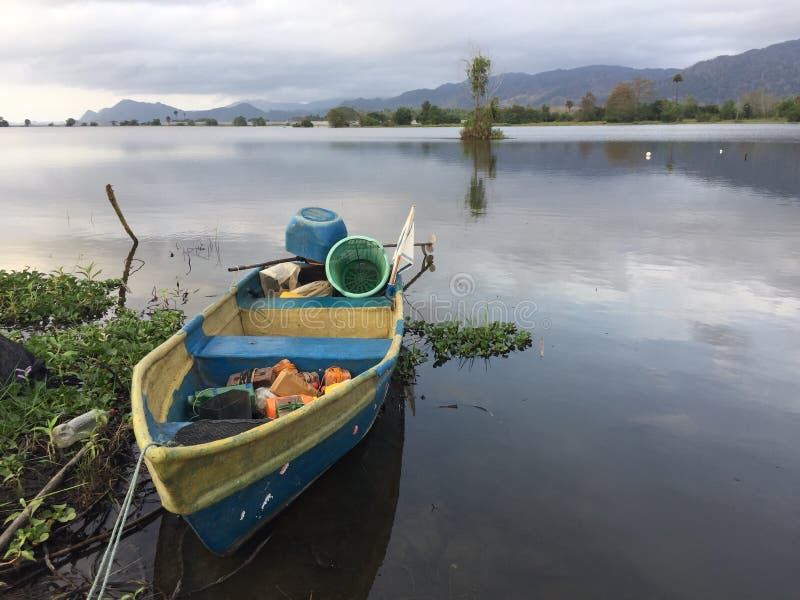 Lake view with small boat stock photo. Image of boat - 113166704
