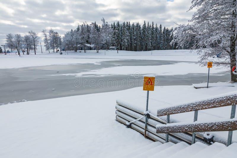 Lake with Warning Sign Thin Ice Stock Photo - Image of stair, snow ...