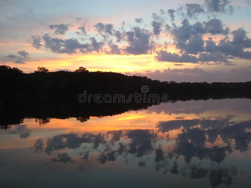 At the Lake Watching the Sunset Stock Photo - Image of watching, nature ...