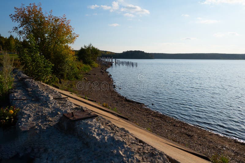 Lake with Waves on the Background of a Sandy Beach and Forest Stock ...