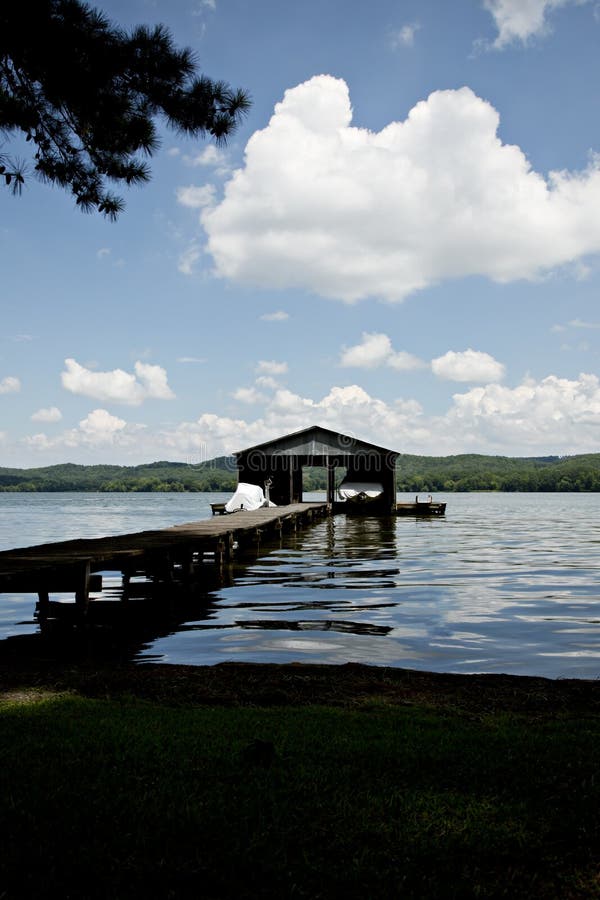 Lakefront Yard with Boathouse and Sky Stock Photo - Image of dock ...