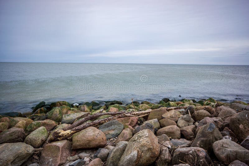 Lakeside Beach Details with Sand, Rocks and Blur Background Stock Photo ...