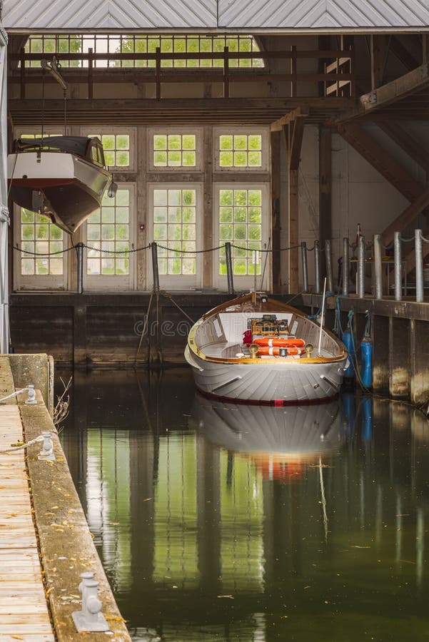 Lakeside boat house stock image. Image of outdoors, flag - 210774461