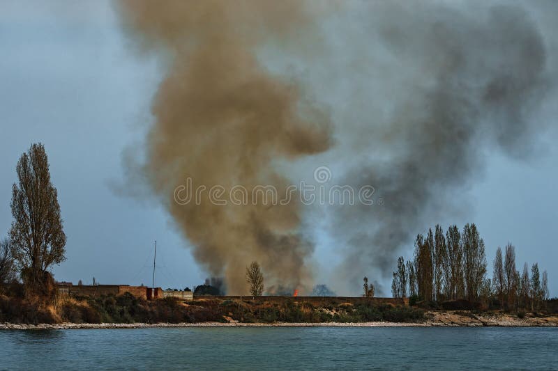 Lakeside fire and smoke stock photo. Image of issykkul - 278953792