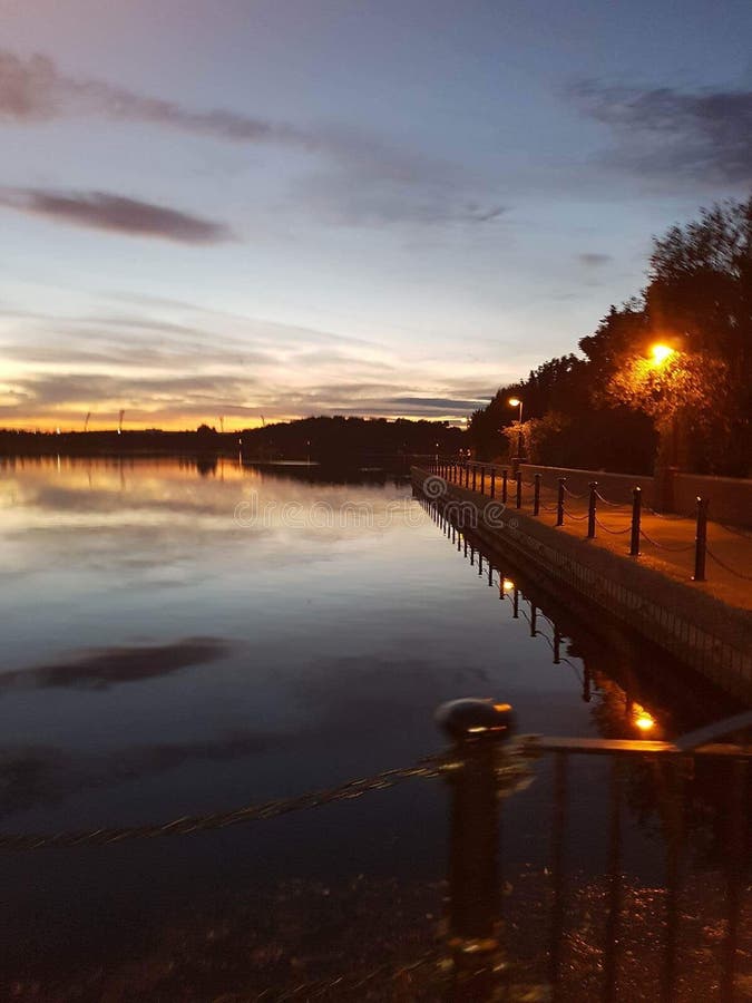 Lakeside sunset stock image. Image of light, night, dark - 88348721