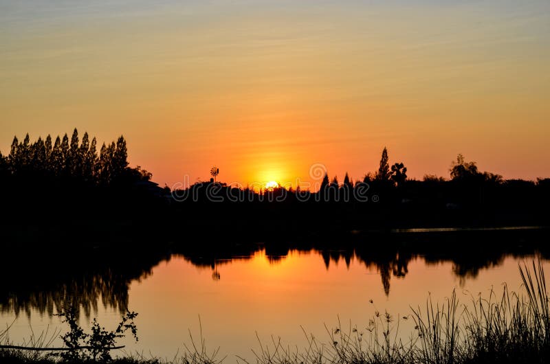 Lakeside sunsets stock photo. Image of park, color, lake - 76453018