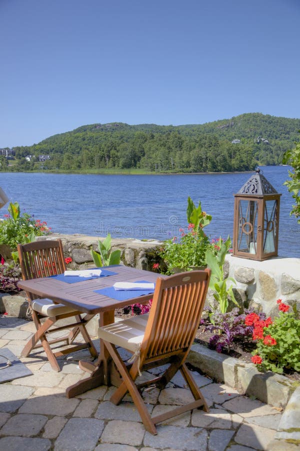 Lakeside table for two stock image. Image of napkins - 26834657