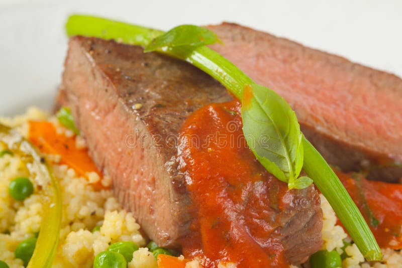 Lamb with basil stock photo. Image of millet, peas, carrots - 57282296