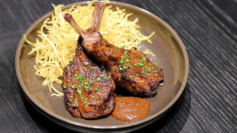 Lamb Chop, Anticucho and Crispy Potato on a Dining Table Stock Photo ...
