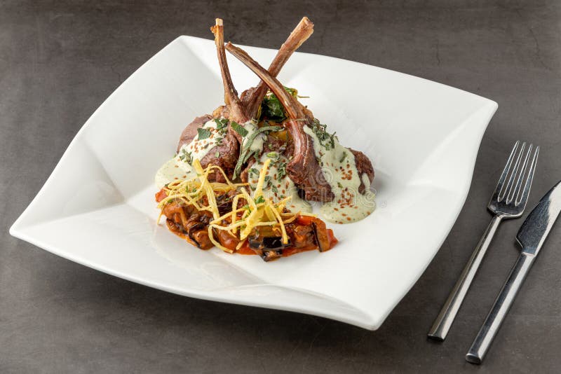 Lamb Chops with Various Vegetables at a Fine Dining Restaurant Stock ...