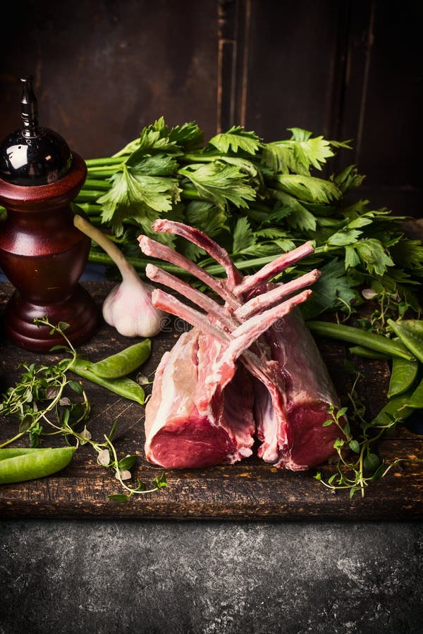 Lamb Meat Cooking on Dark Rustic Kitchen Table, Top View Stock Image ...