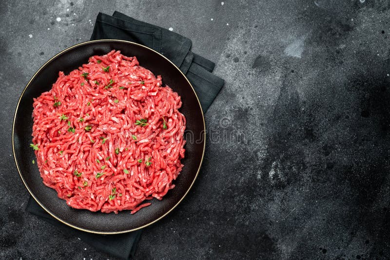 Lamb Mutton Ground Mince Raw Meat, Forcemeat on a Black Plate, Top View ...