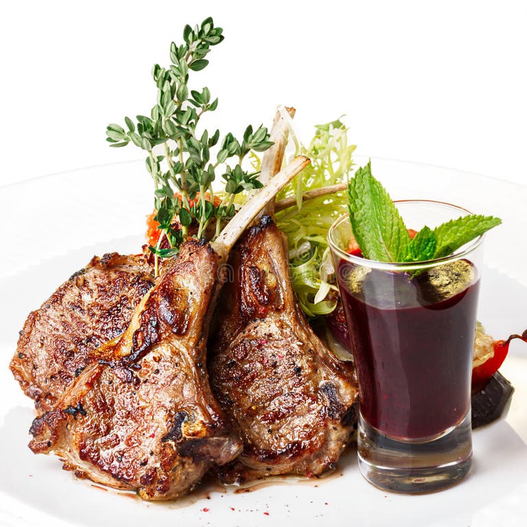 Lamb rack with garnish stock photo. Image of herbs, plate - 44877880