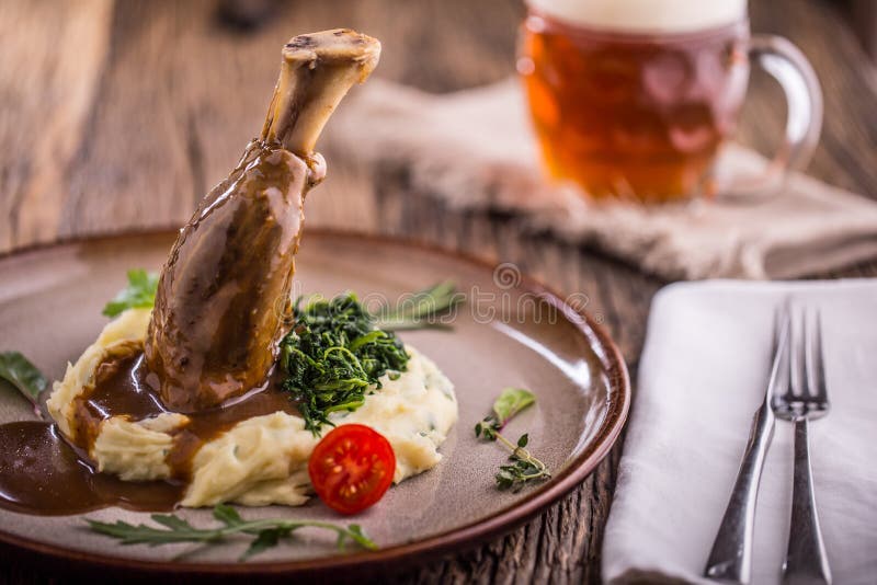 Lamb Shank.Confit Lamb Shank with Mashed Potatoes Spinach and Draft ...