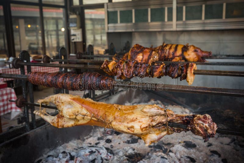 Lamb and Suckling Pig Roasted on a Spit Stock Image - Image of ...