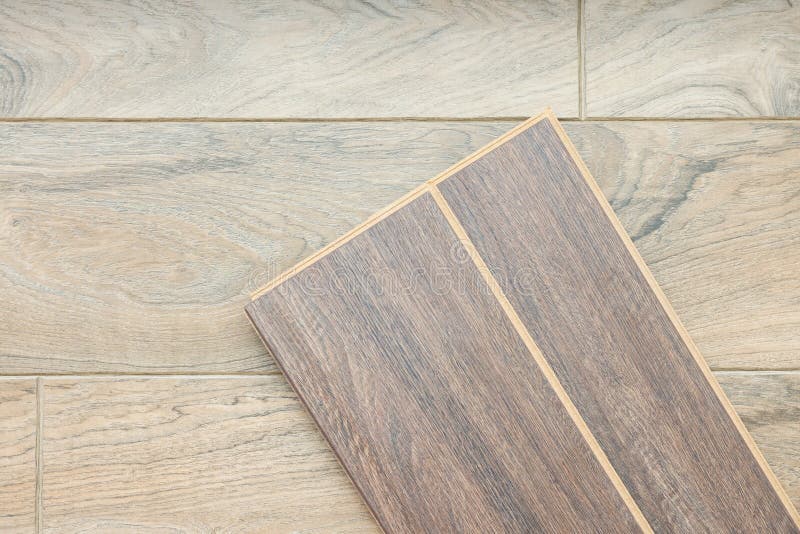Laminate Flooring Pieces on Wooden Surface, Top View Stock Image ...