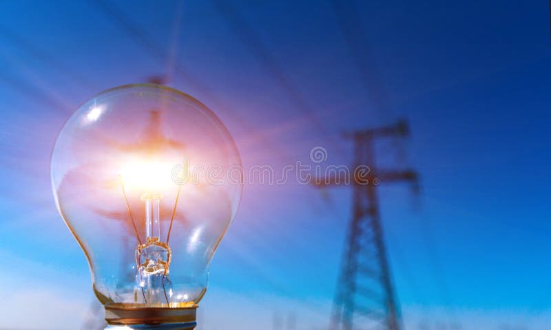 Lamp on the Background of High-voltage Power Lines at Sunset. Greeb ...