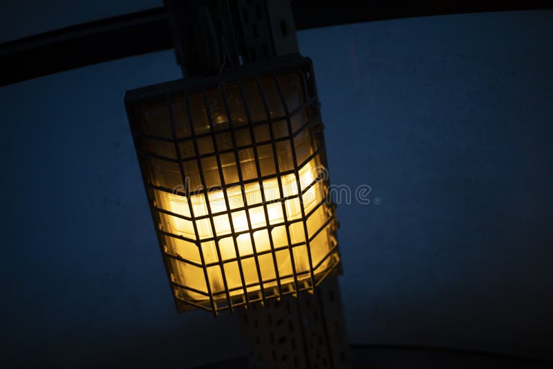 Lamp Behind Bars. Dim Lamp Light Stock Photo - Image of industrial ...