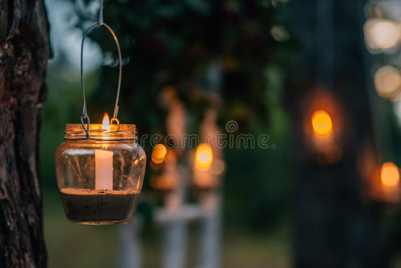 Lamp with Candle is Hanging on a Tree at Night. Wedding Nigh Stock ...