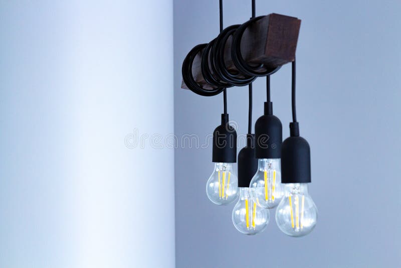 The Lamp on the Ceiling of the Light Bulbs Located on the Wires Stock ...