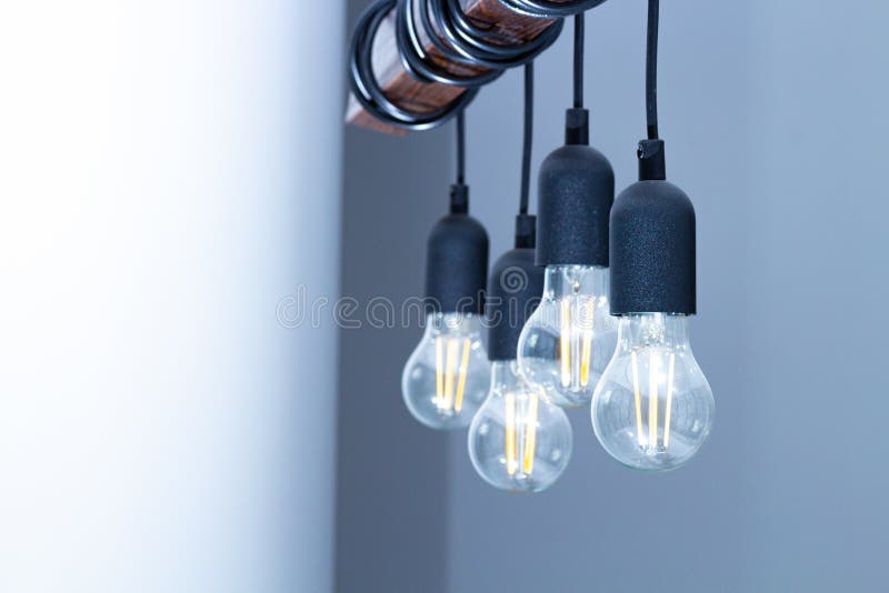 The Lamp on the Ceiling of the Light Bulbs Located on the Wires Stock ...