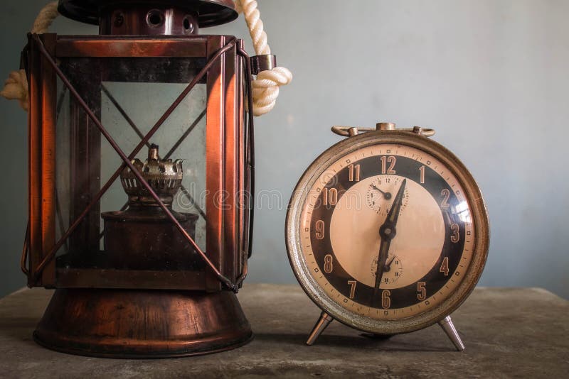 Lamp and clock on table. stock image. Image of clock - 58392737