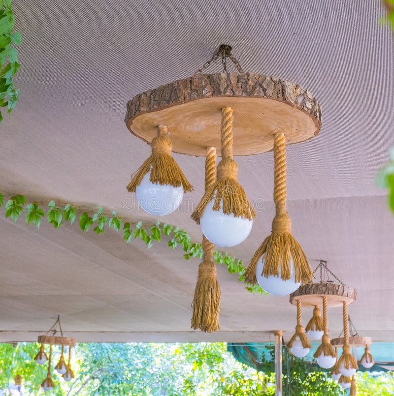 A Lamp of Electric Light in a Rope and Cut Down a Tree in a Summer ...