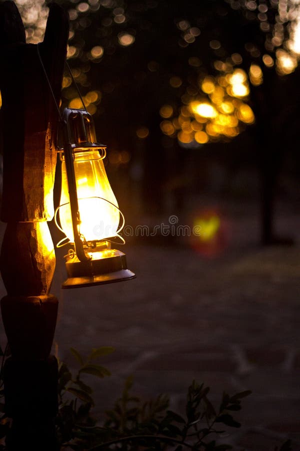 Lamp Hanging from Log at Night Stock Photo - Image of hanging ...