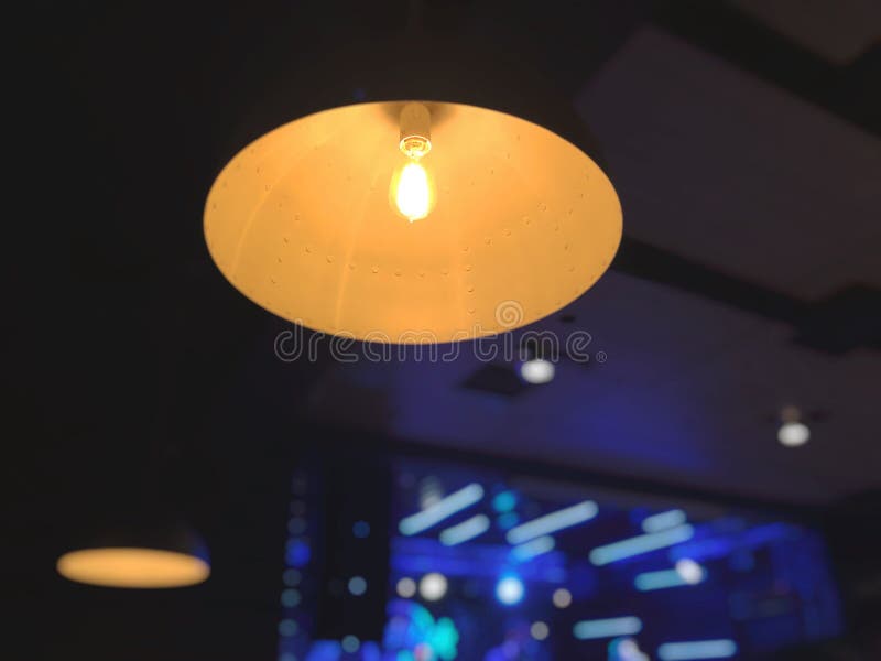 Lamp Hanging Over the Table in a Rock Cafe on the Background of the ...