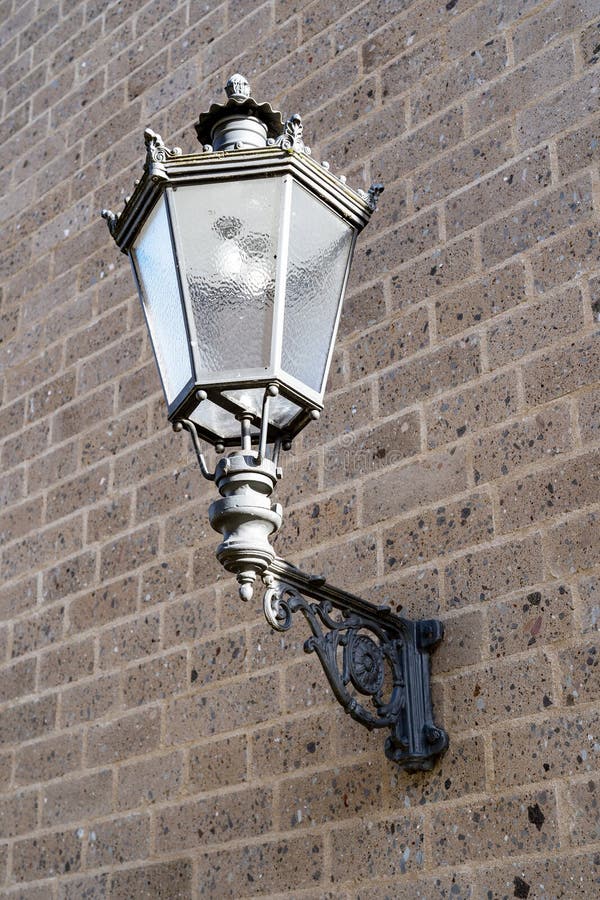 A Lamp is Hanging from a Wall Stock Image - Image of lamp, decorative ...