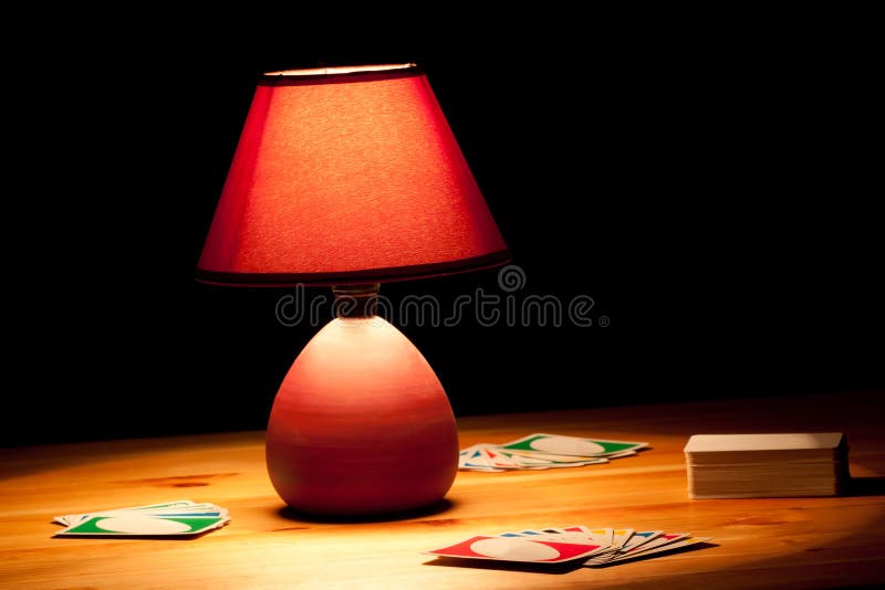Lamp illuminating cards stock image. Image of home, book - 17656379