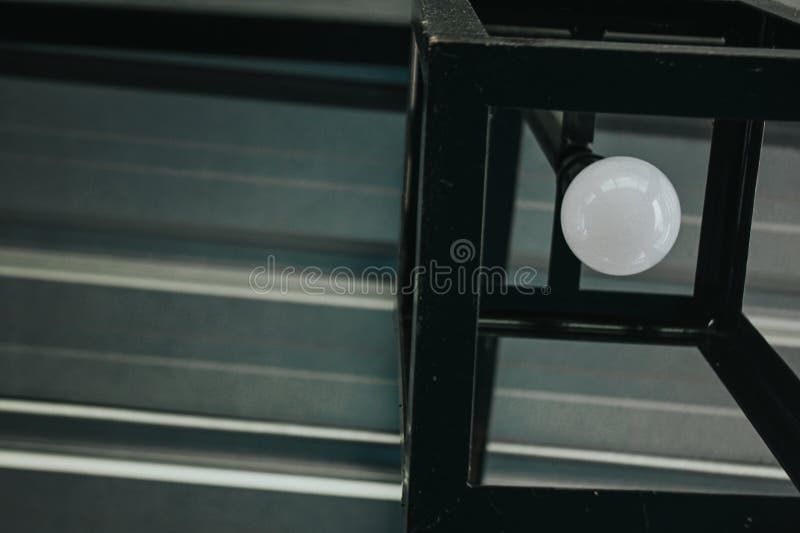 A Lamp in the Middle of the Iron Box Stock Image - Image of iron, light ...