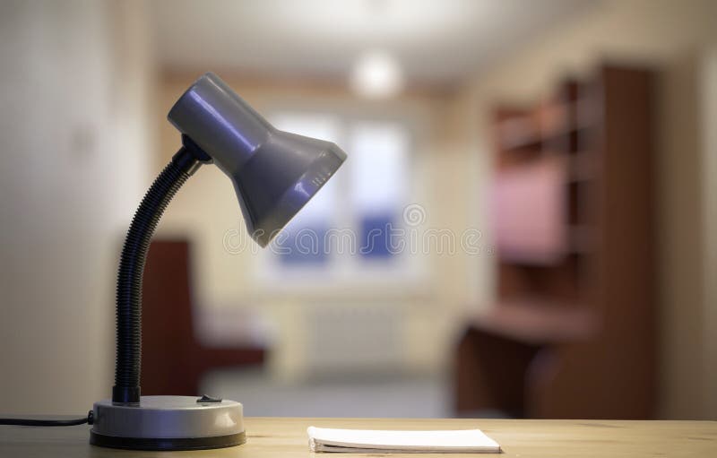 Lamp and notebook on table stock photo. Image of decoration - 78661640