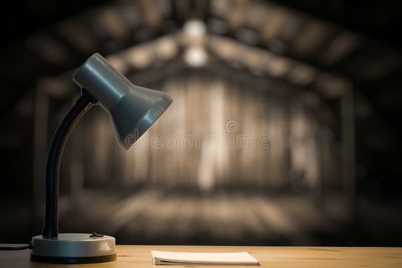 Lamp and notebook on table stock photo. Image of paper - 172392472