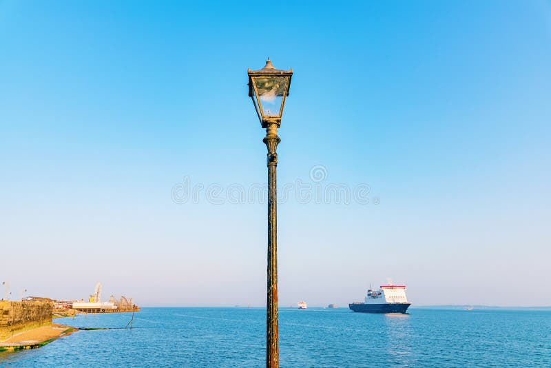 Lamp post by ocean stock image. Image of water, light - 5559177