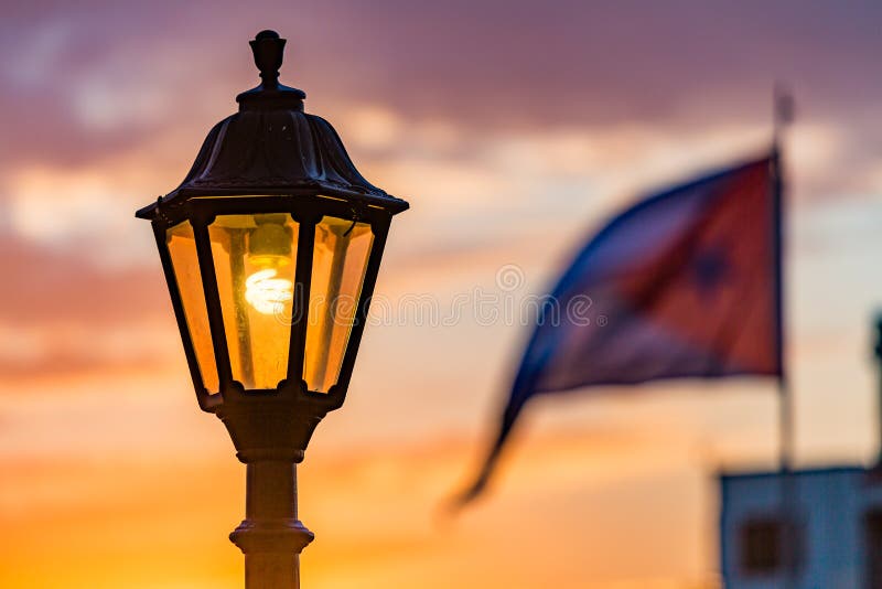 Lamp Post and Cuban Flag at Sunrise Stock Image - Image of post, flying ...