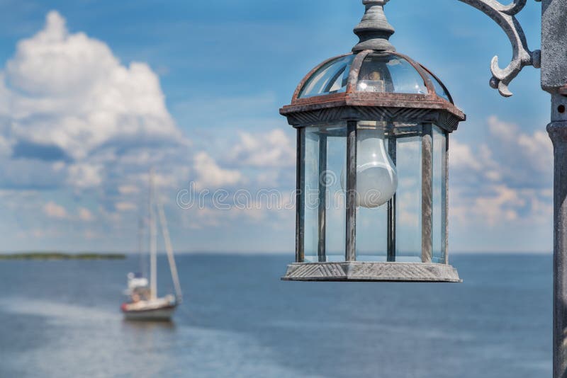 Lamp Post with Light Bulb by the Ocean Stock Image - Image of ...