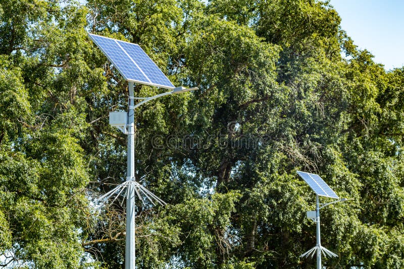 Lamp Post with Solar Panel System on Road with Blue Sky and Trees ...