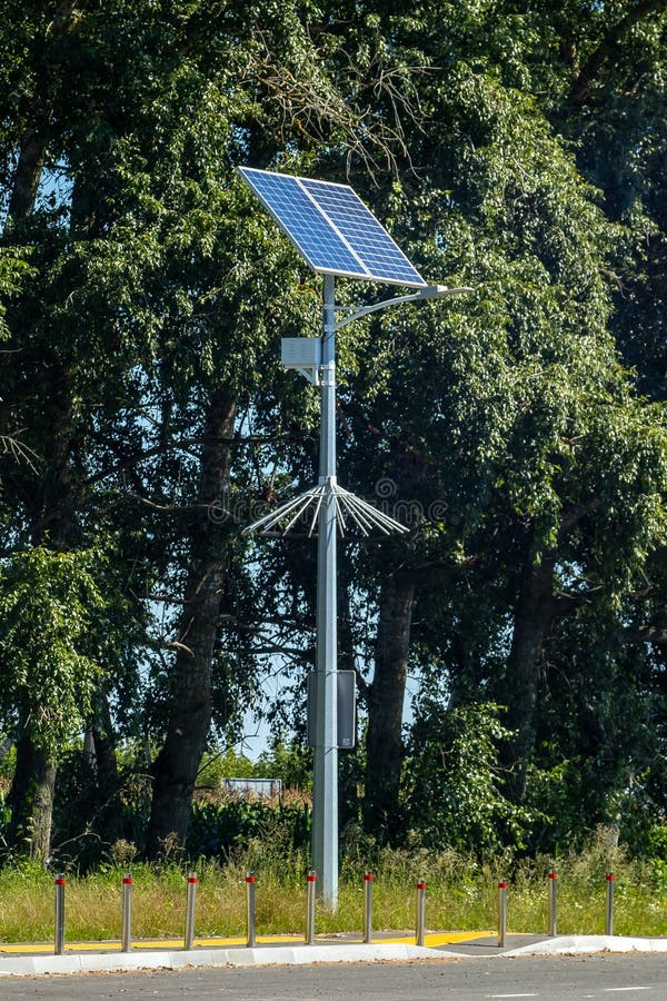 Lamp Post with Solar Panel System on Road with Blue Sky and Trees ...
