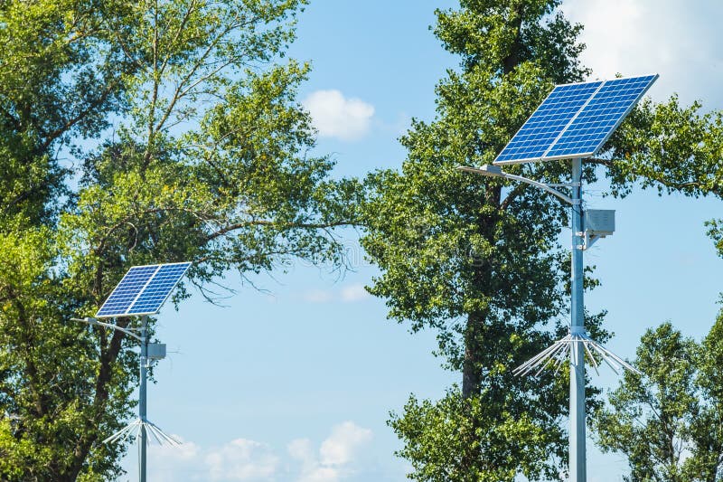 Lamp Post with Solar Panel System on Road with Blue Sky and Trees ...