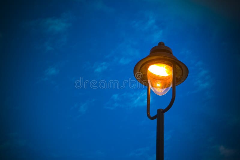 Lamp Post Turned on Against a Dark Sky Stock Image - Image of dark ...