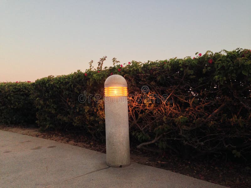 Lamp Post on the walkway stock photo. Image of orange - 99473220