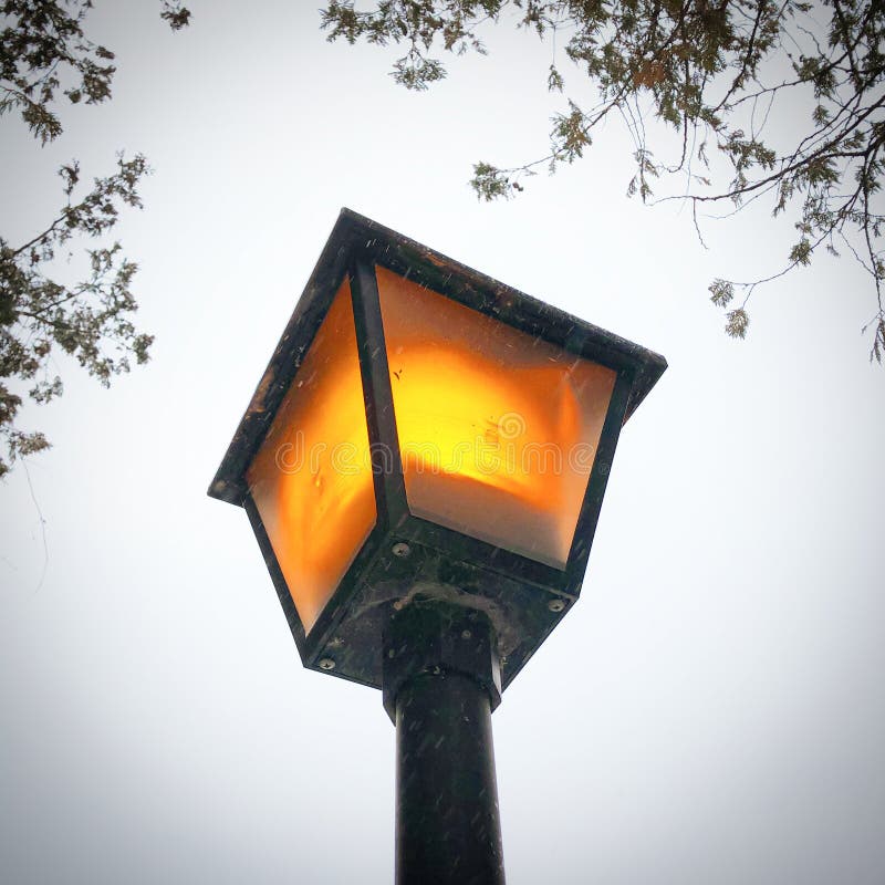 Lamp Post with Warm Yellow Glow Stock Image - Image of town, fashioned ...