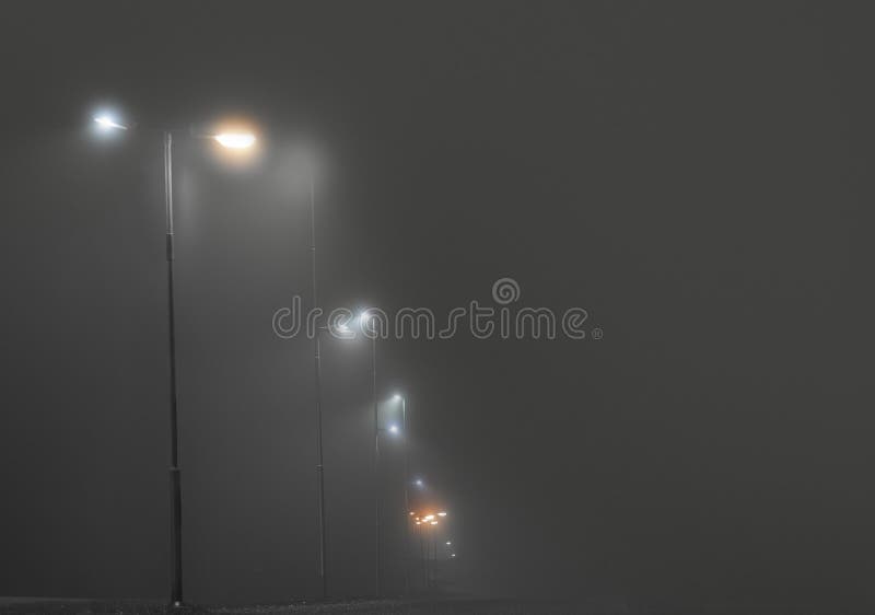 Lamp posts in heavy fog stock image. Image of mystery - 203043453