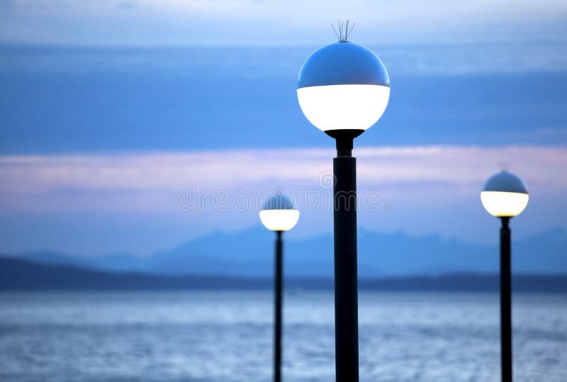 Lamp Posts Lit At Night, Blue Mountains At Dusk Stock Photo - Image of ...