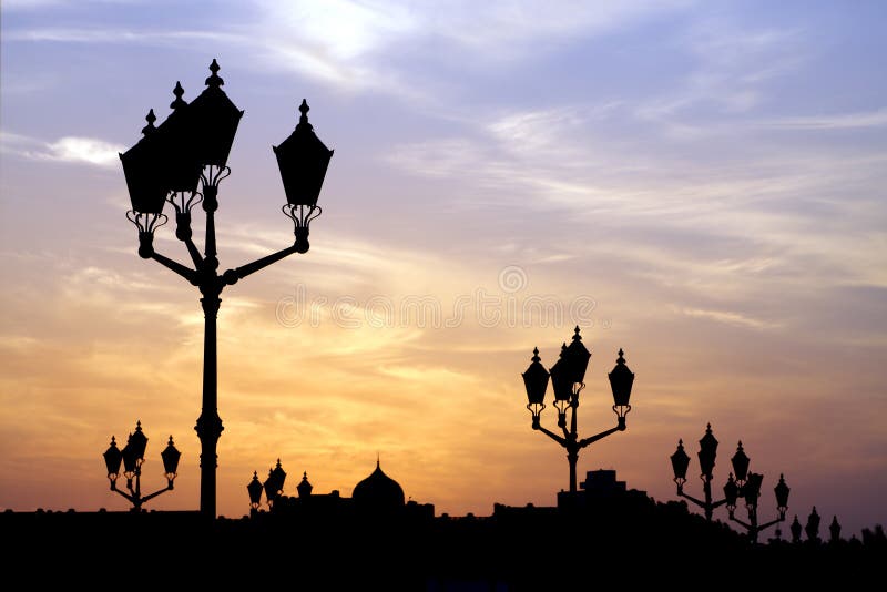 Lamp posts at sunset stock photo. Image of golden, lantern - 27291118